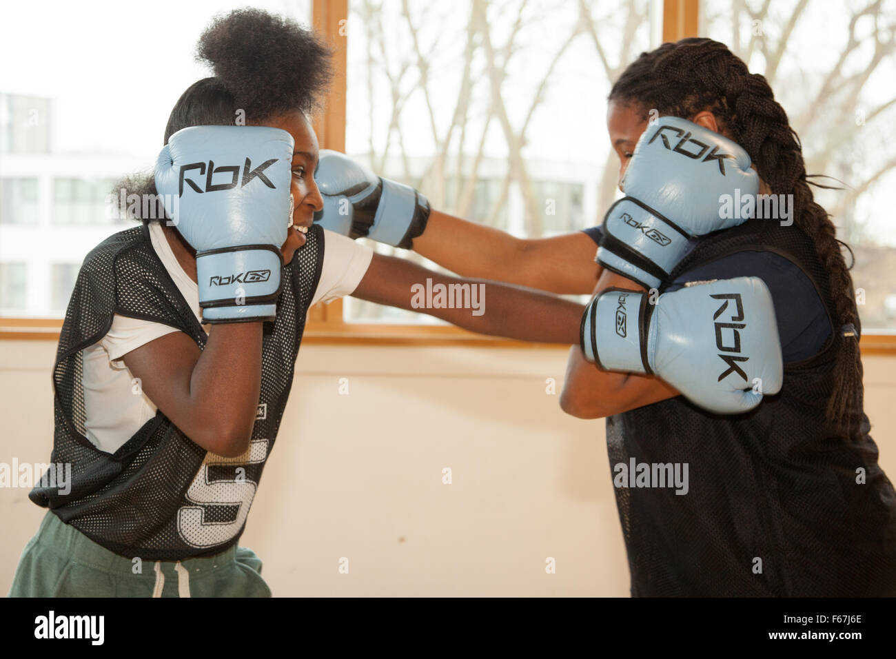 Female teenager students being coached in boxing Stock Photo - Alamy