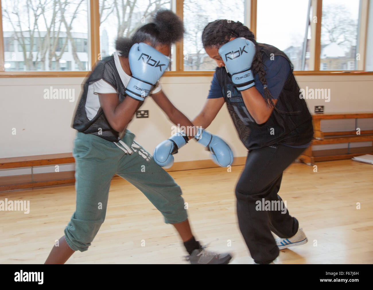 Female teenager students being coached in boxing Stock Photo - Alamy