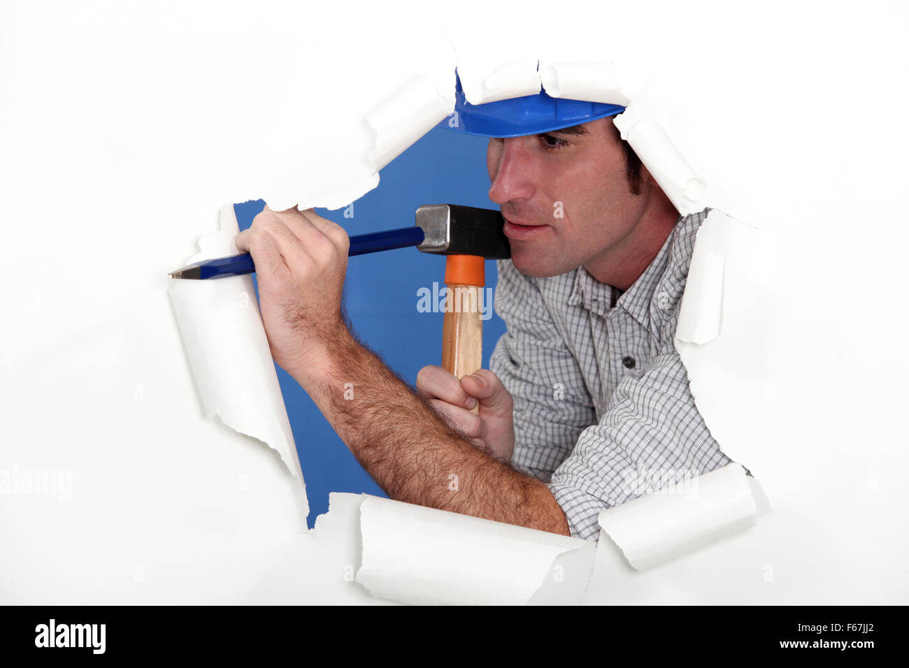 Man carefully using hammer Stock Photo - Alamy