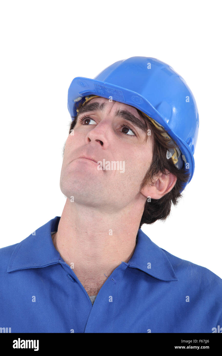 craftsman looking upset Stock Photo - Alamy