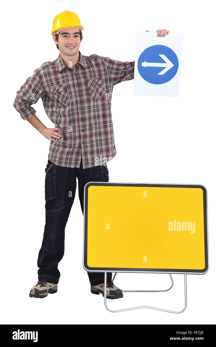 Man holding traffic sign Stock Photo - Alamy