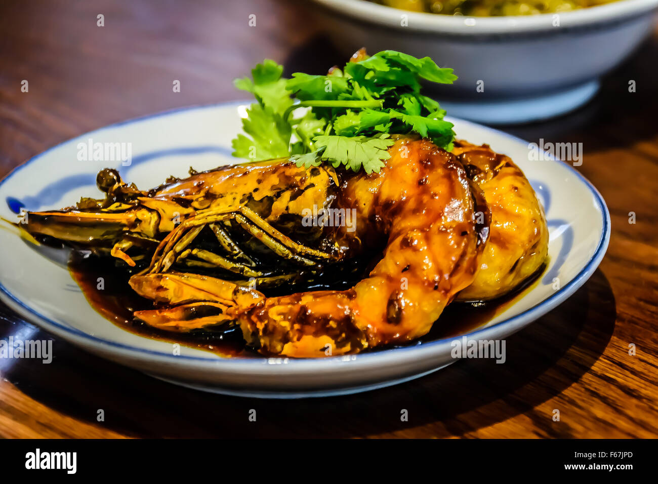 Udang Assam Goreng Stir-fried prawns in tangy tamarind paste Stock ...