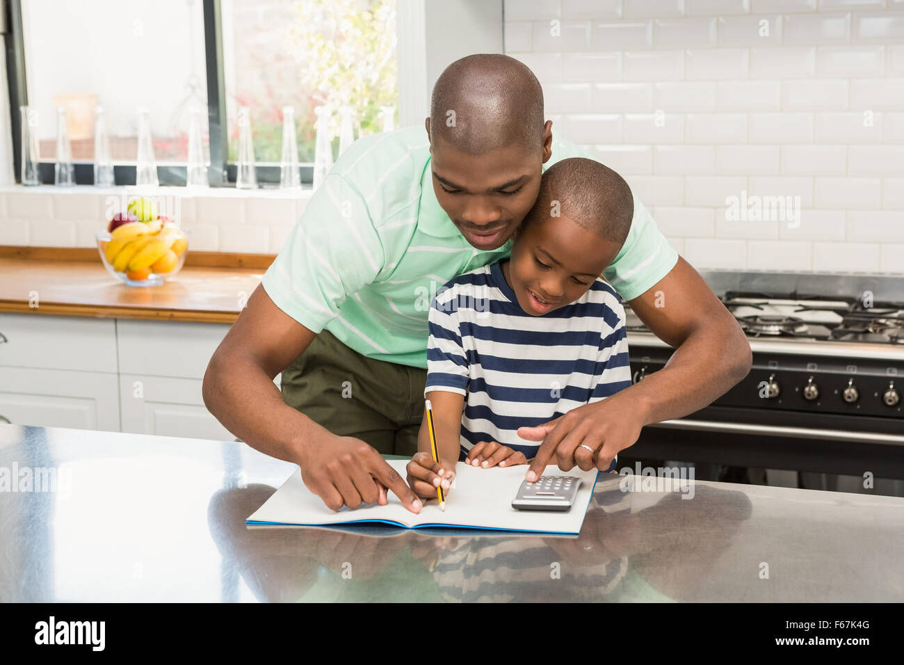 Father helping his son with homework Stock Photo - Alamy