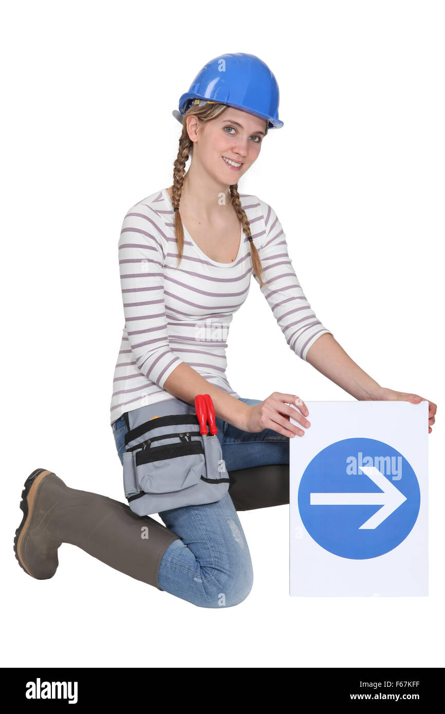 Woman with road sign Stock Photo - Alamy