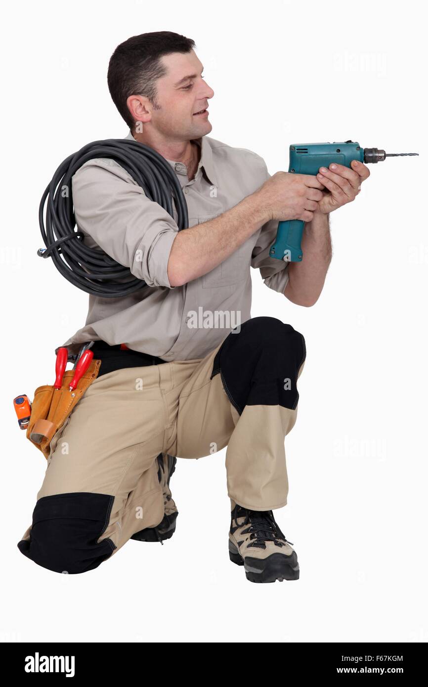 Handyman using screwdriver drill Cut Out Stock Images & Pictures - Alamy