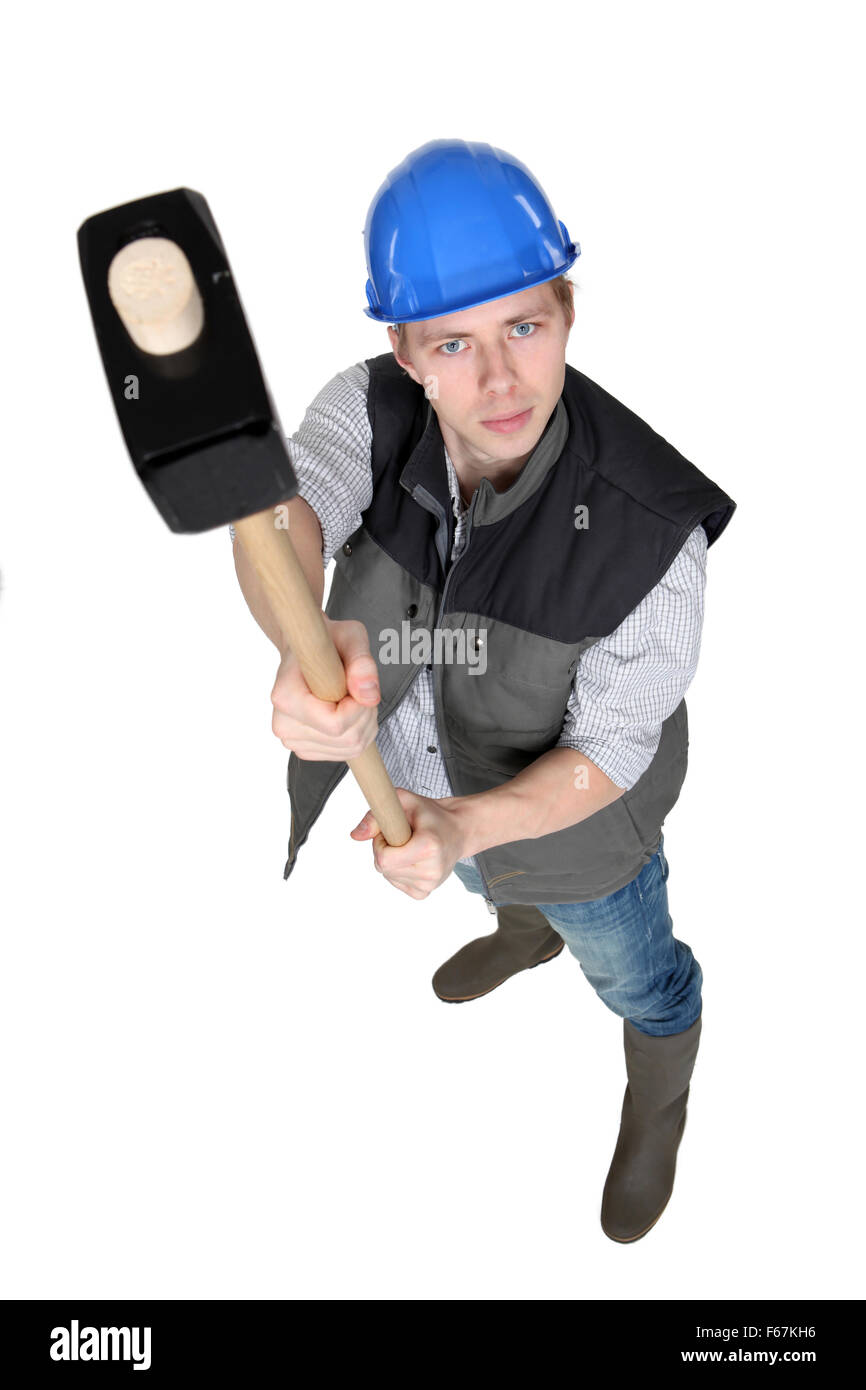 Construction worker with large hammer Stock Photo - Alamy