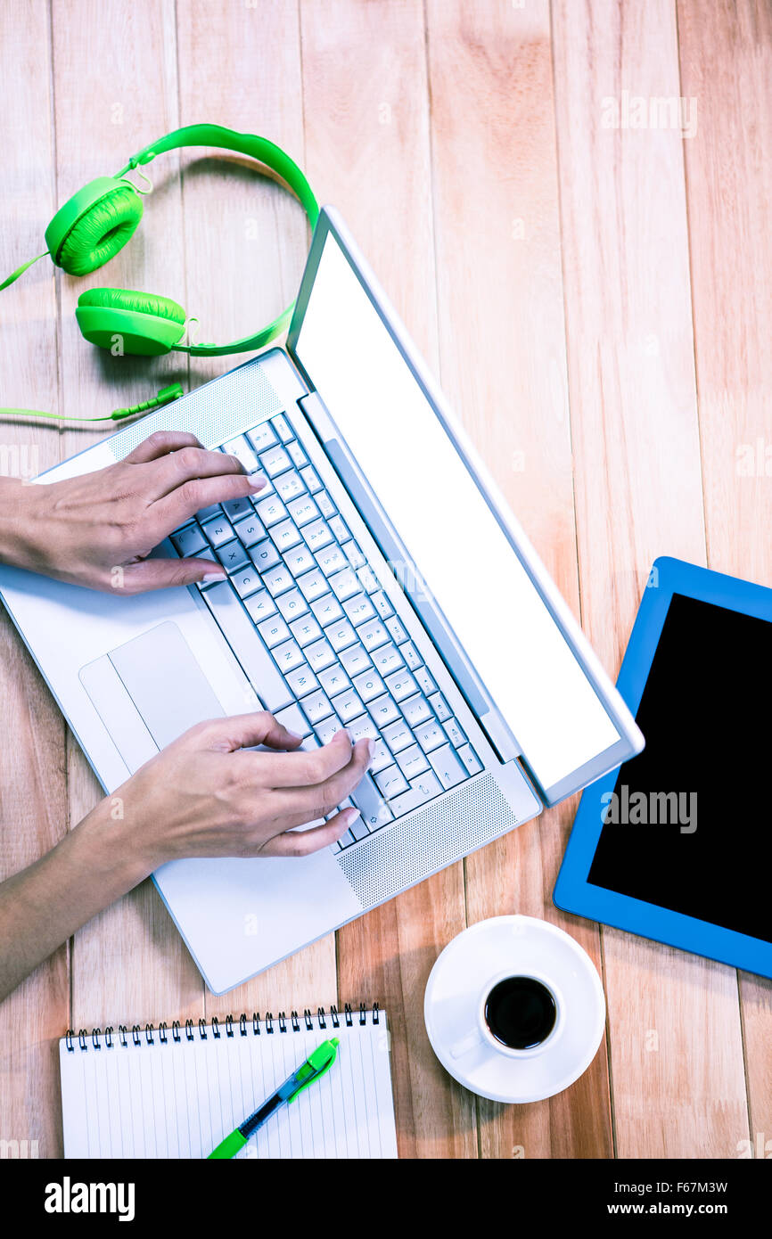 Overhead of feminine hands typing on laptop Stock Photo - Alamy