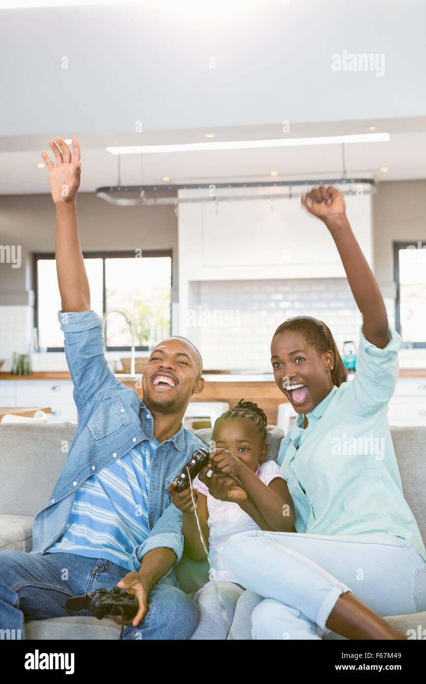 Happy family playing video games Stock Photo - Alamy
