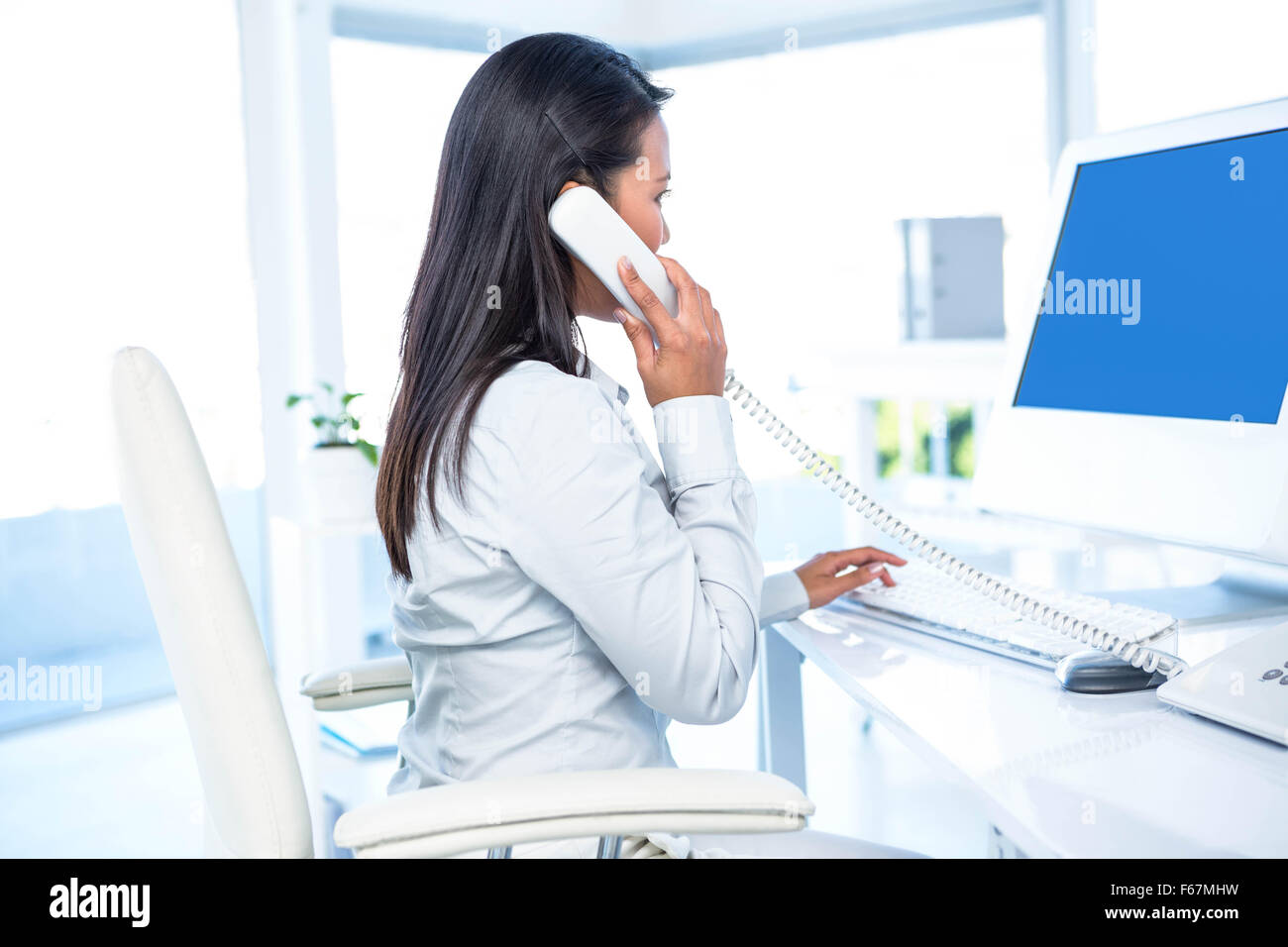 Side view asian woman typing hi-res stock photography and images - Alamy