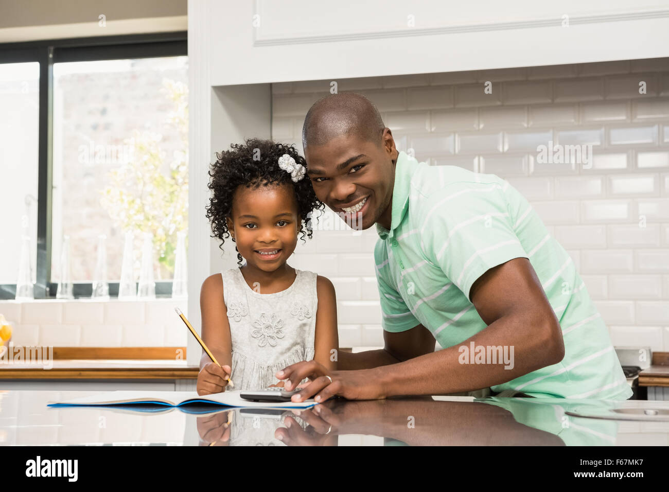 Daughter helping father hi-res stock photography and images - Alamy