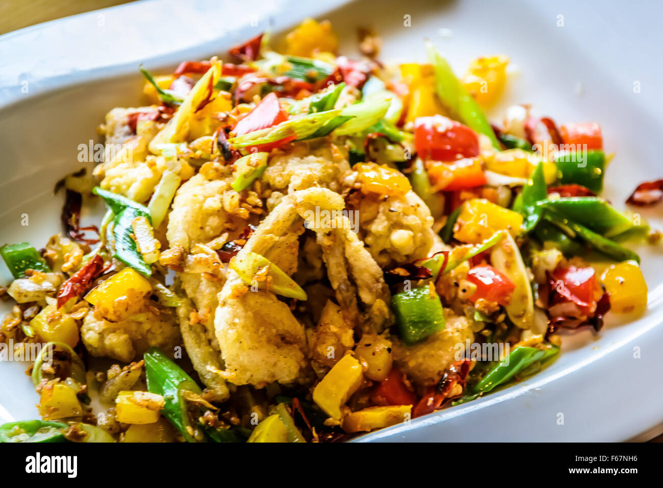 Stir-fried frog legs Stock Photo - Alamy