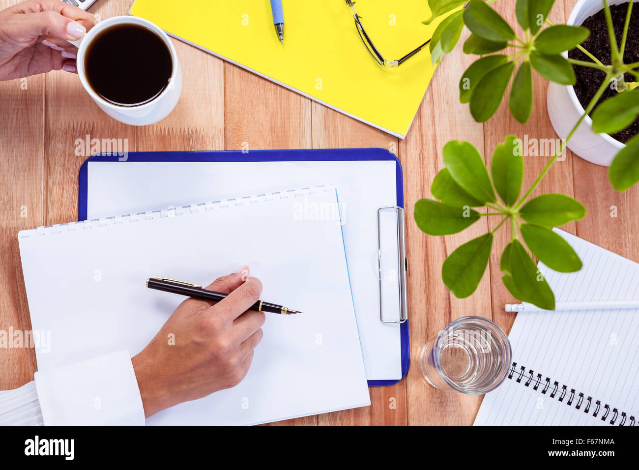 Part of hands taking notes Stock Photo - Alamy