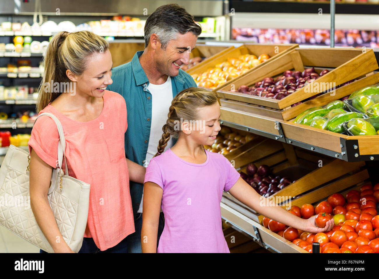 Young family doing some shopping Stock Photo - Alamy