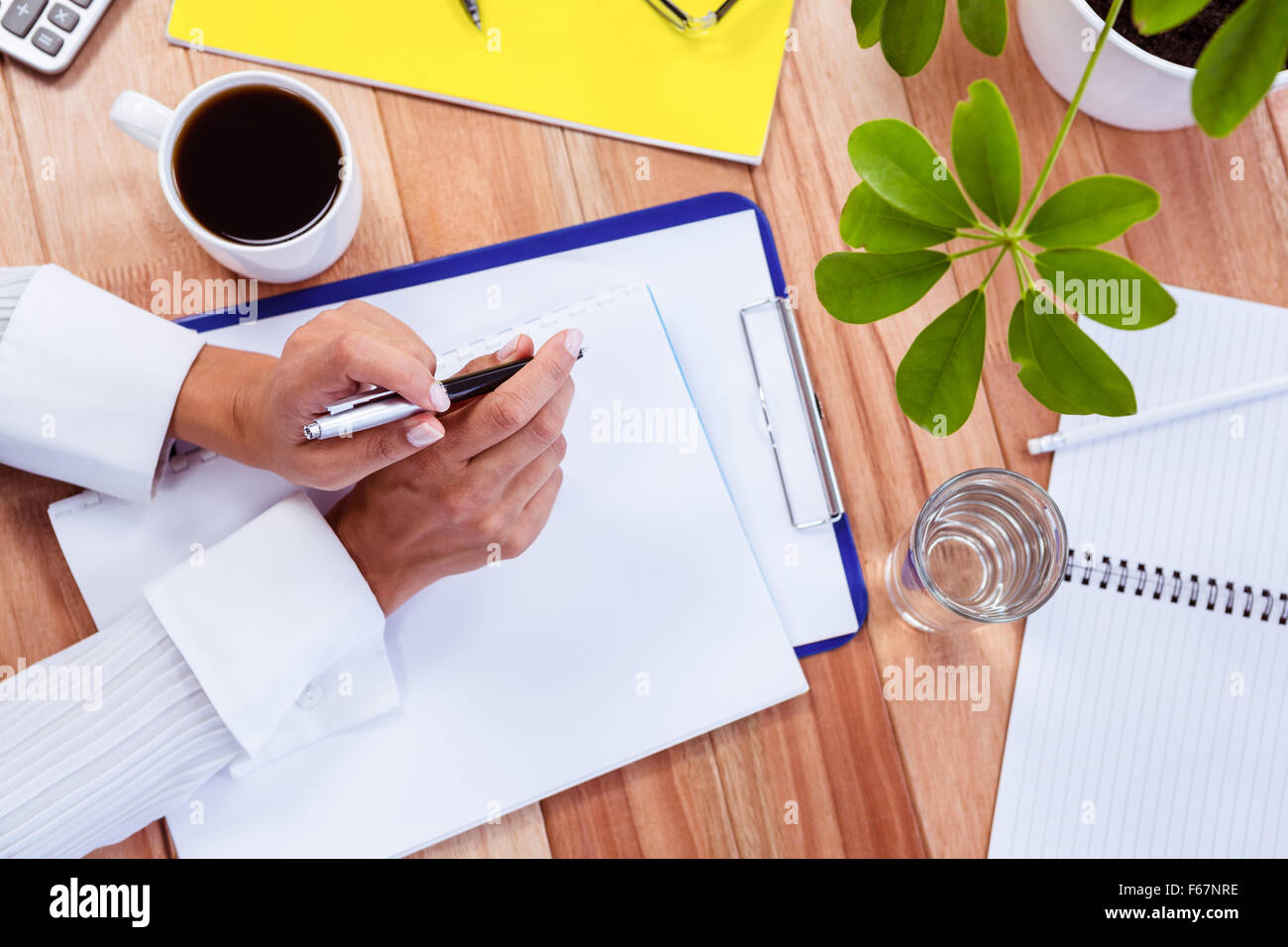 Part of hands taking notes Stock Photo - Alamy