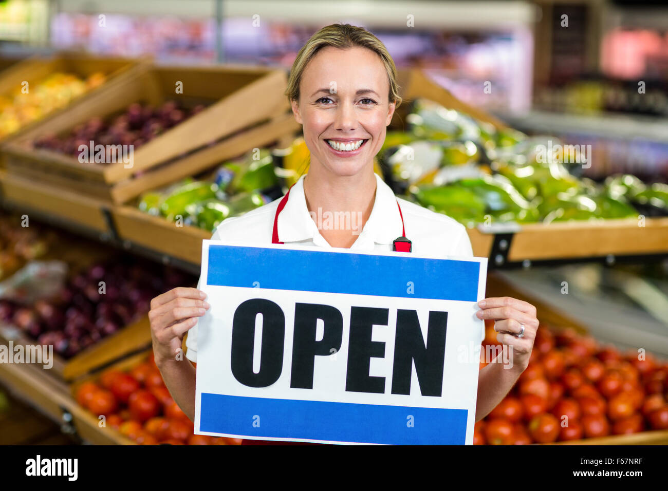 Woman holding sign hi-res stock photography and images - Alamy