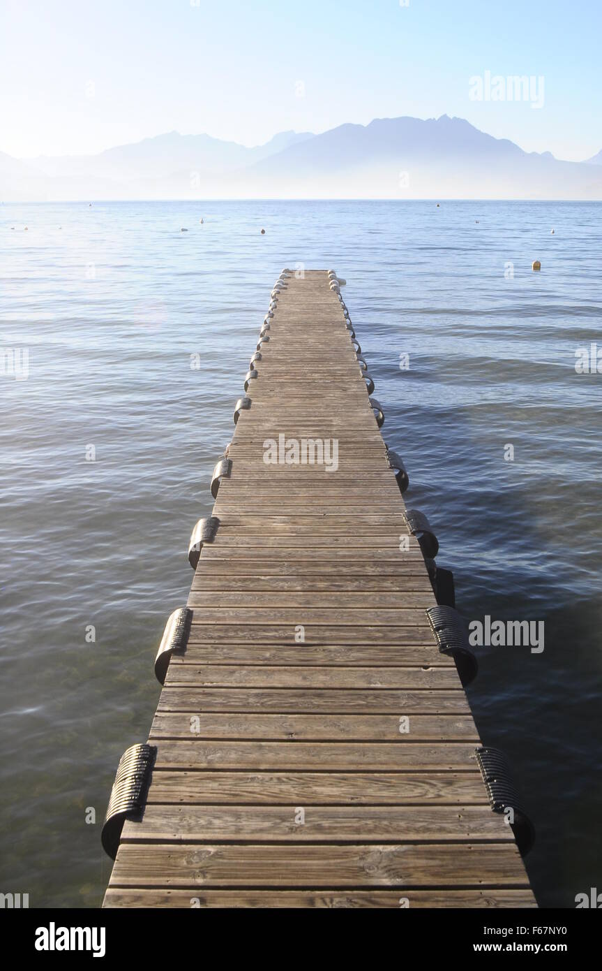 Landscape of Annecy lake and wooden pontoon France Stock Photo - Alamy