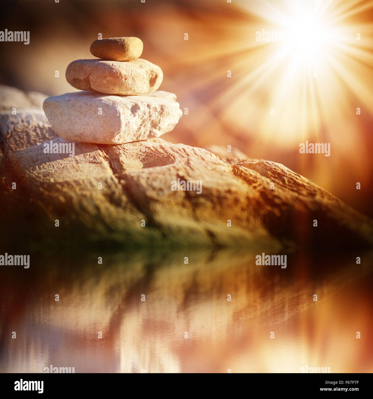 three stones lighted bright sun Stock Photo - Alamy