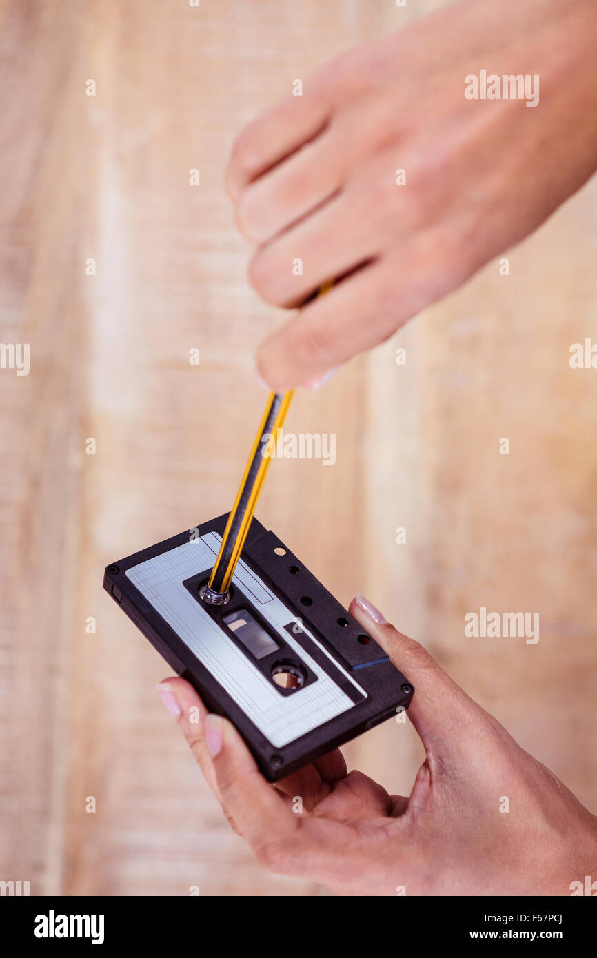 Woman rewinding old tape Stock Photo - Alamy