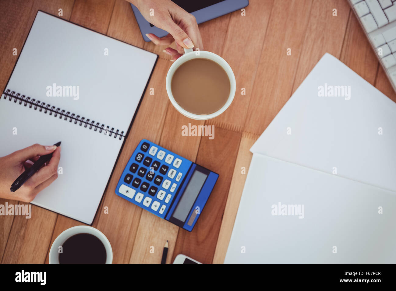 Professional using calculator notepad hi-res stock photography and ...