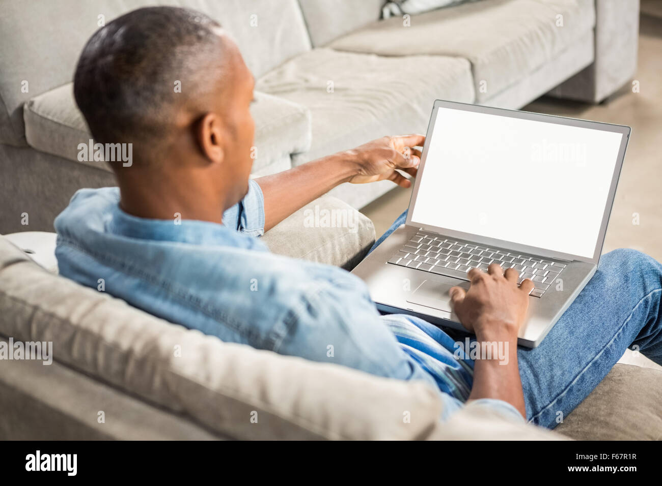 Over the shoulder man using laptop hi-res stock photography and images ...