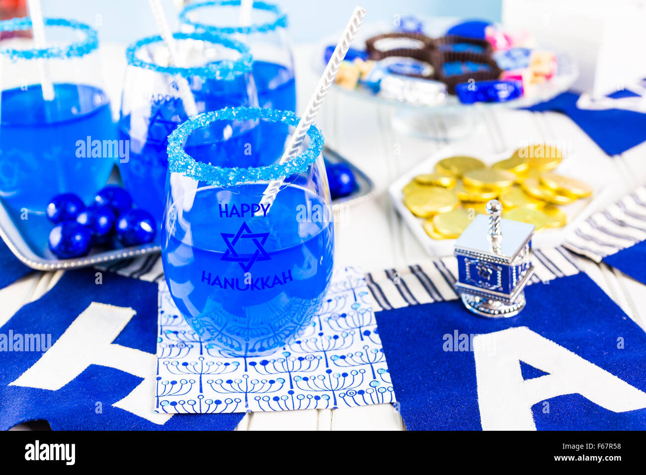Table set with cocktails and chocolates to celebrate Hanukkah Stock ...