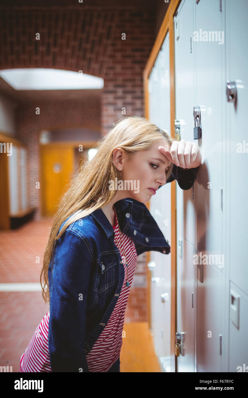 Worried leaning against the locker Stock Photo - Alamy