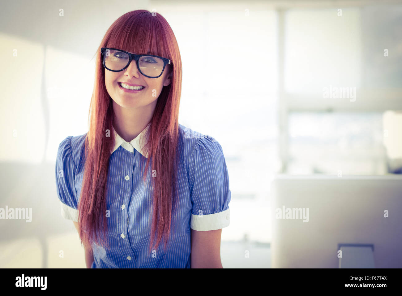 Attractive smiling hipster woman posing Stock Photo - Alamy