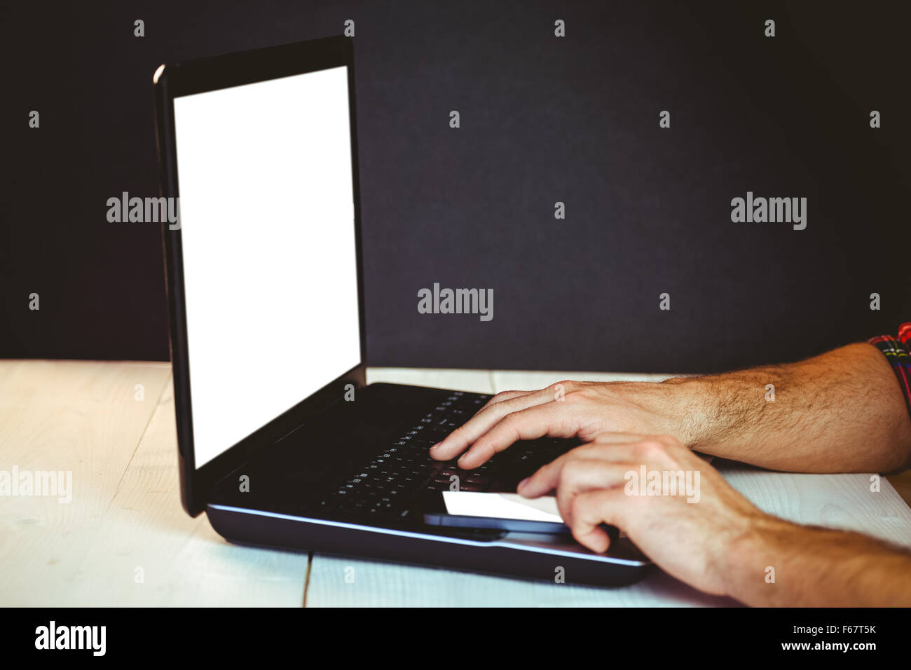 Man using his laptop Stock Photo - Alamy
