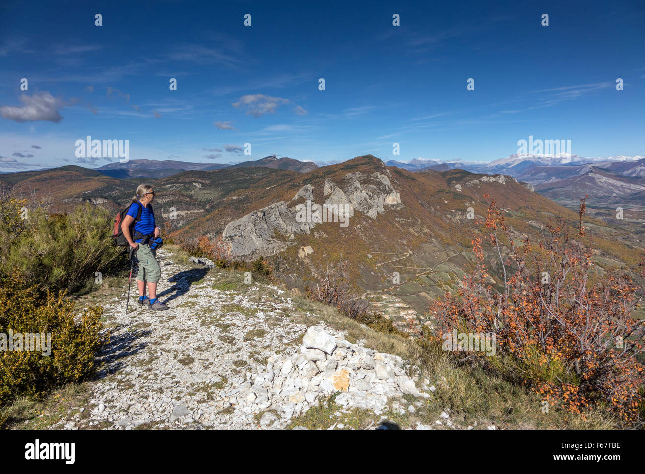Solitary female figure in blue above Orpierre, Provence, France seen ...