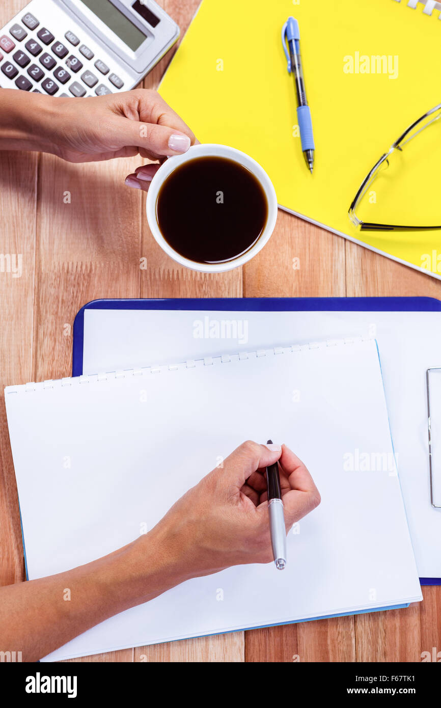 Part of hands taking notes Stock Photo - Alamy