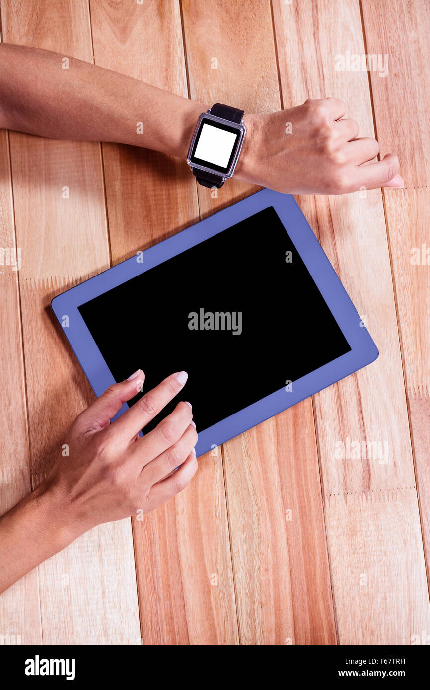 Woman with smart watch and digital tablet Stock Photo - Alamy
