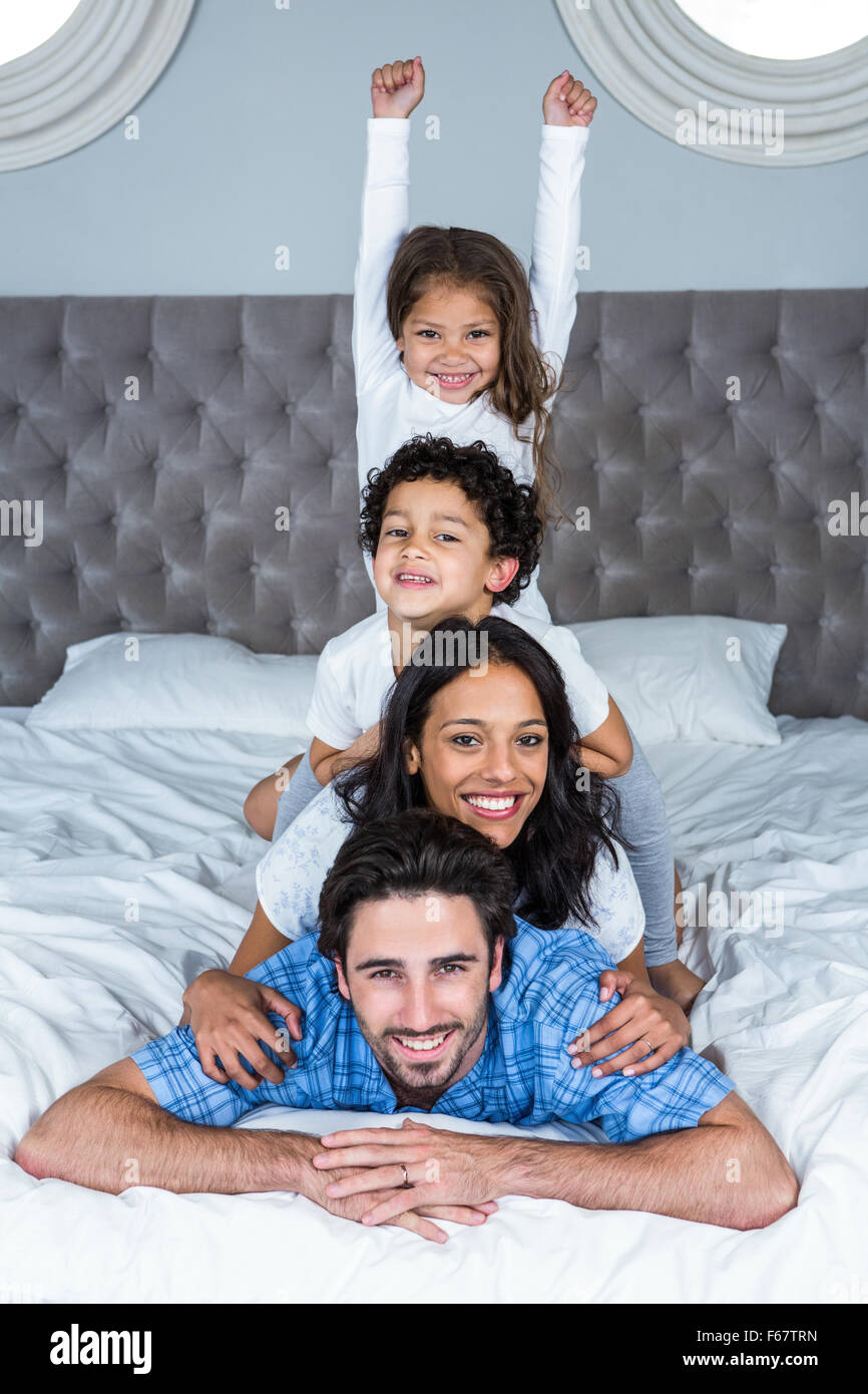 Happy family posing for camera Stock Photo - Alamy