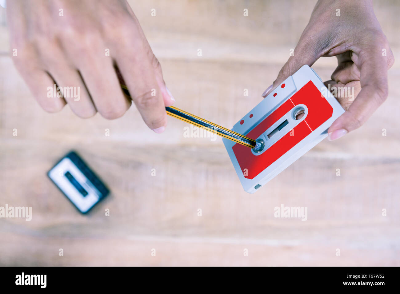 Woman rewinding old tape Stock Photo - Alamy