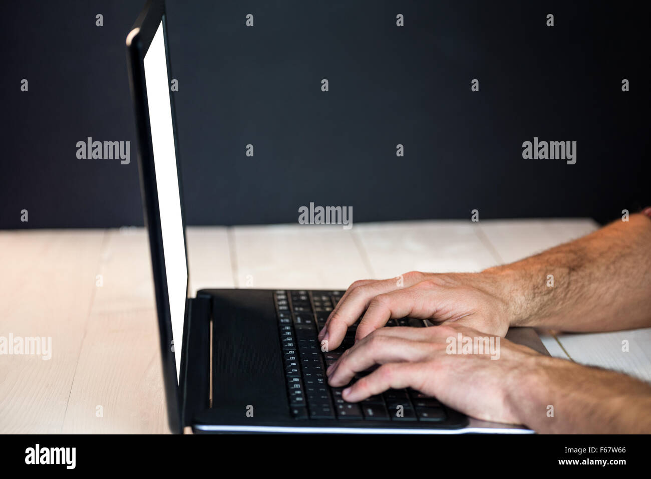Man using his laptop Stock Photo - Alamy