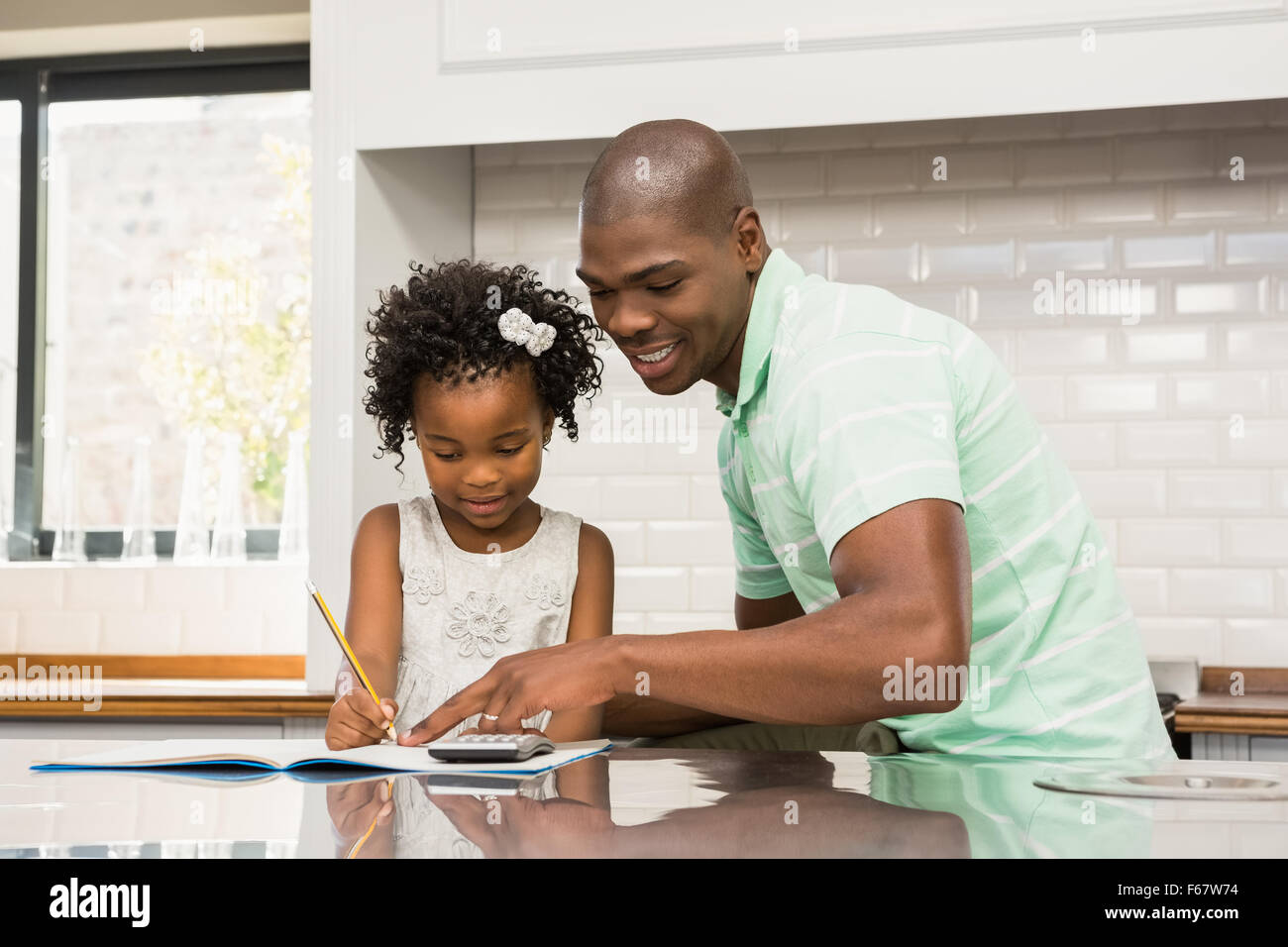 Father helping his daughter with homework Stock Photo - Alamy