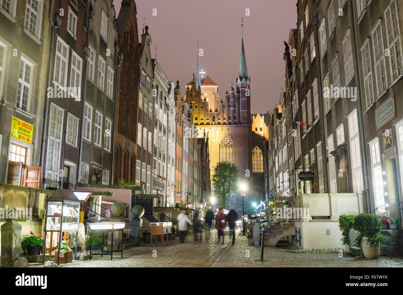Mariacka Street (St. Mary's basilica in background) by night. Mariacka ...