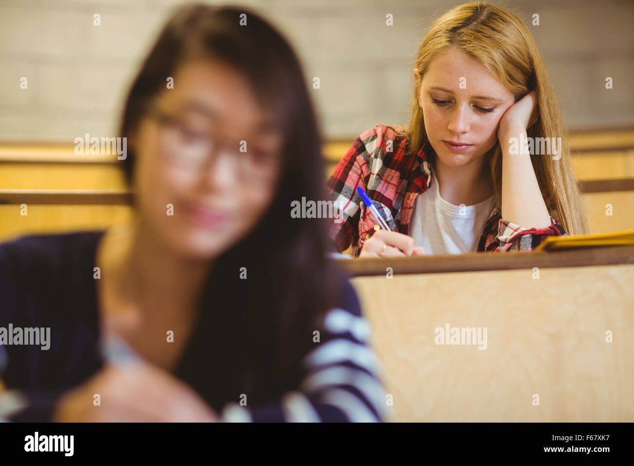 Thoughtful student during class Stock Photo - Alamy