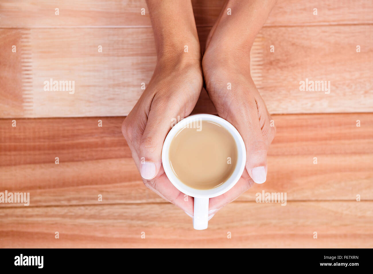 Womans hands holding cup of coffee Stock Photo - Alamy