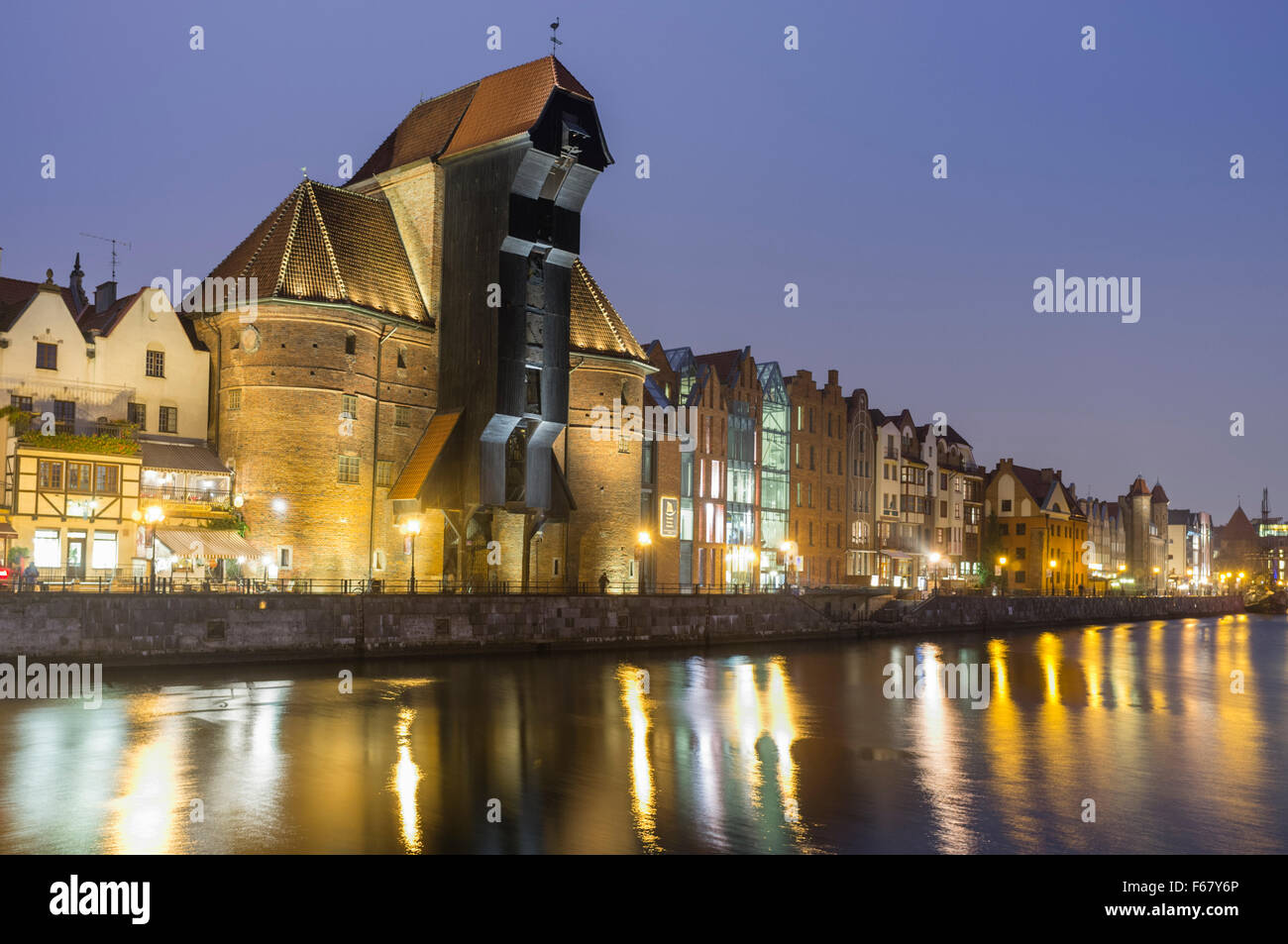 Medieval crane and Waterfront tenements reflected on Motlawa river at ...