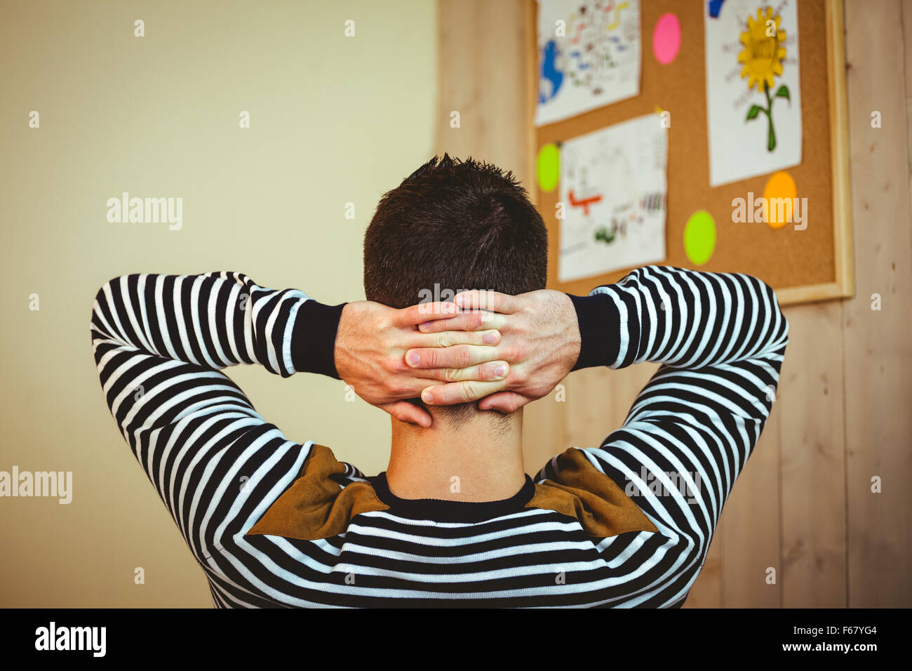 Man relaxing at his desk Stock Photo - Alamy