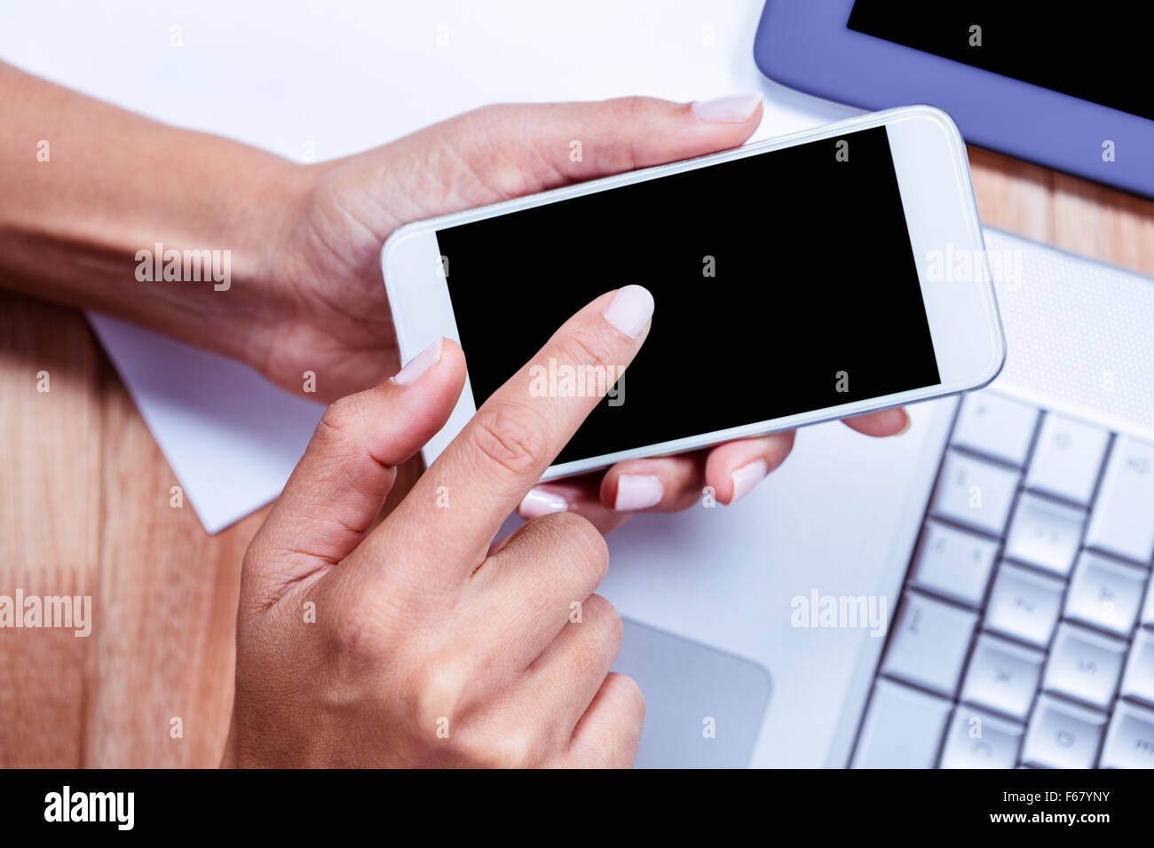 Woman scrolling smartphone desk hi-res stock photography and images - Alamy