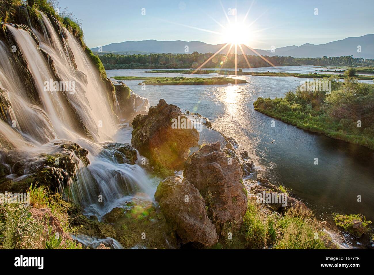 Sunset over a waterfall along the Snake River in the Morley Nelson ...