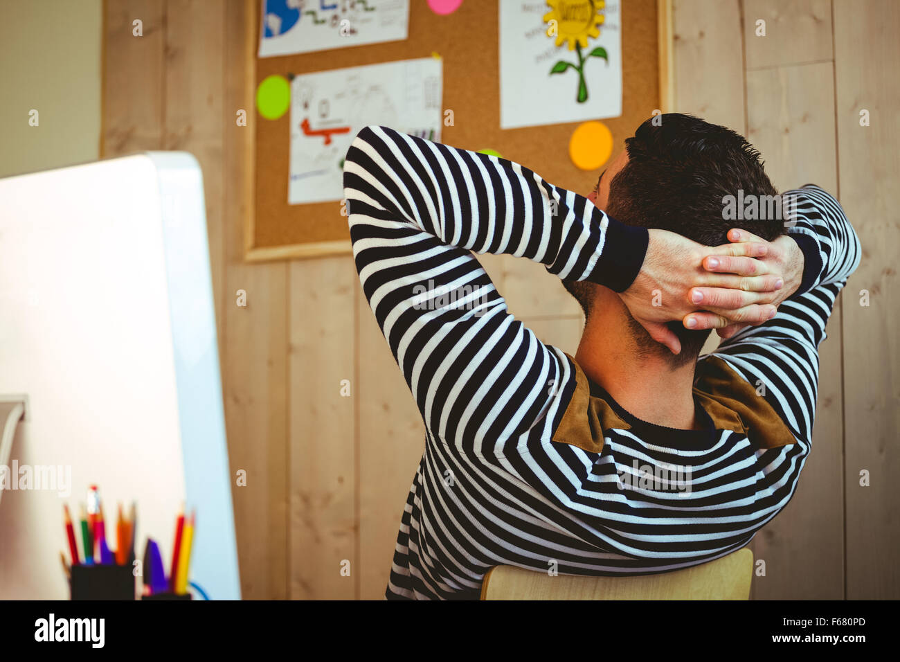 Man relaxing at his desk Stock Photo - Alamy