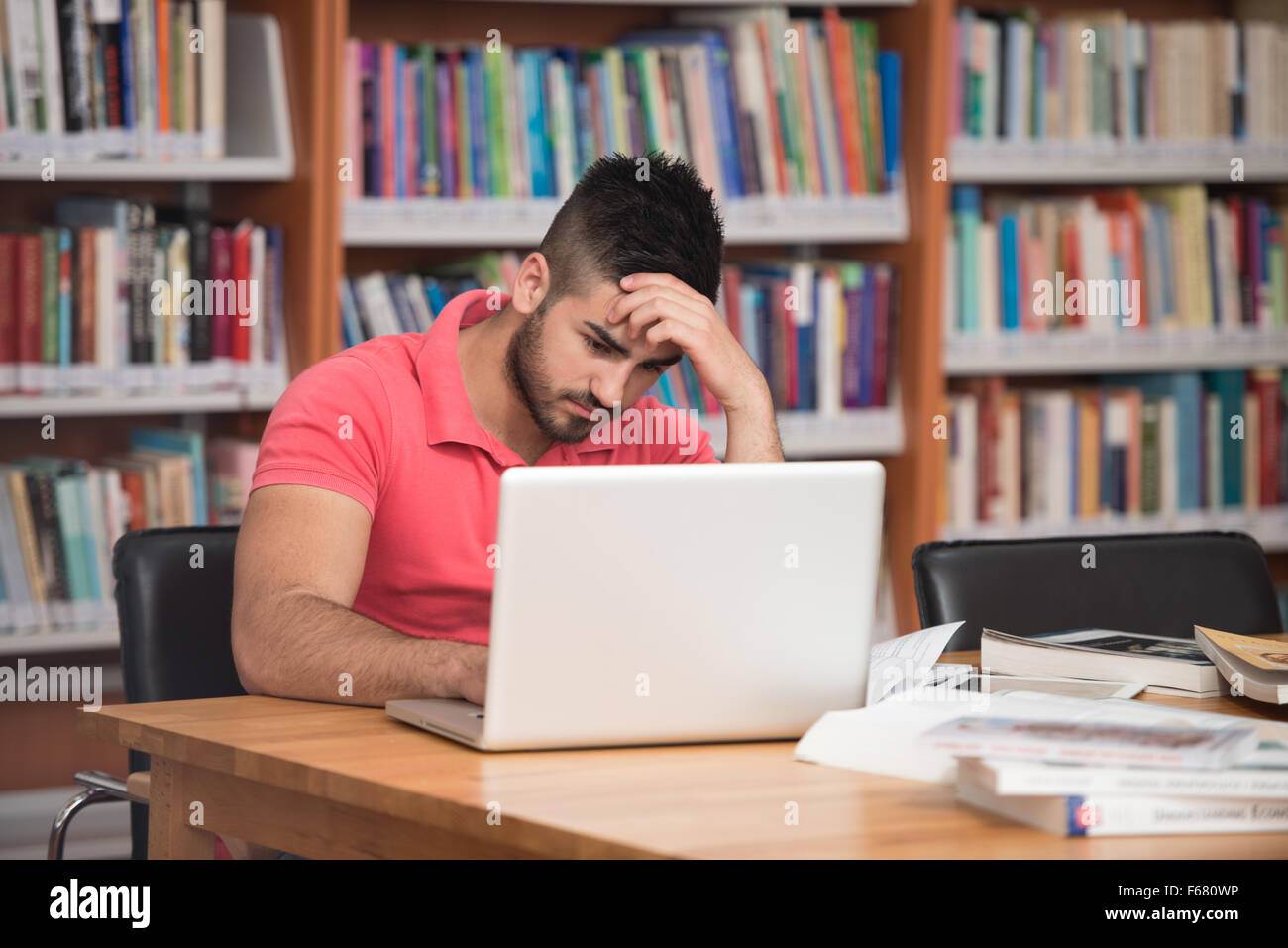 Arabic Male College Student Stressed About His Homework Stock Photo - Alamy
