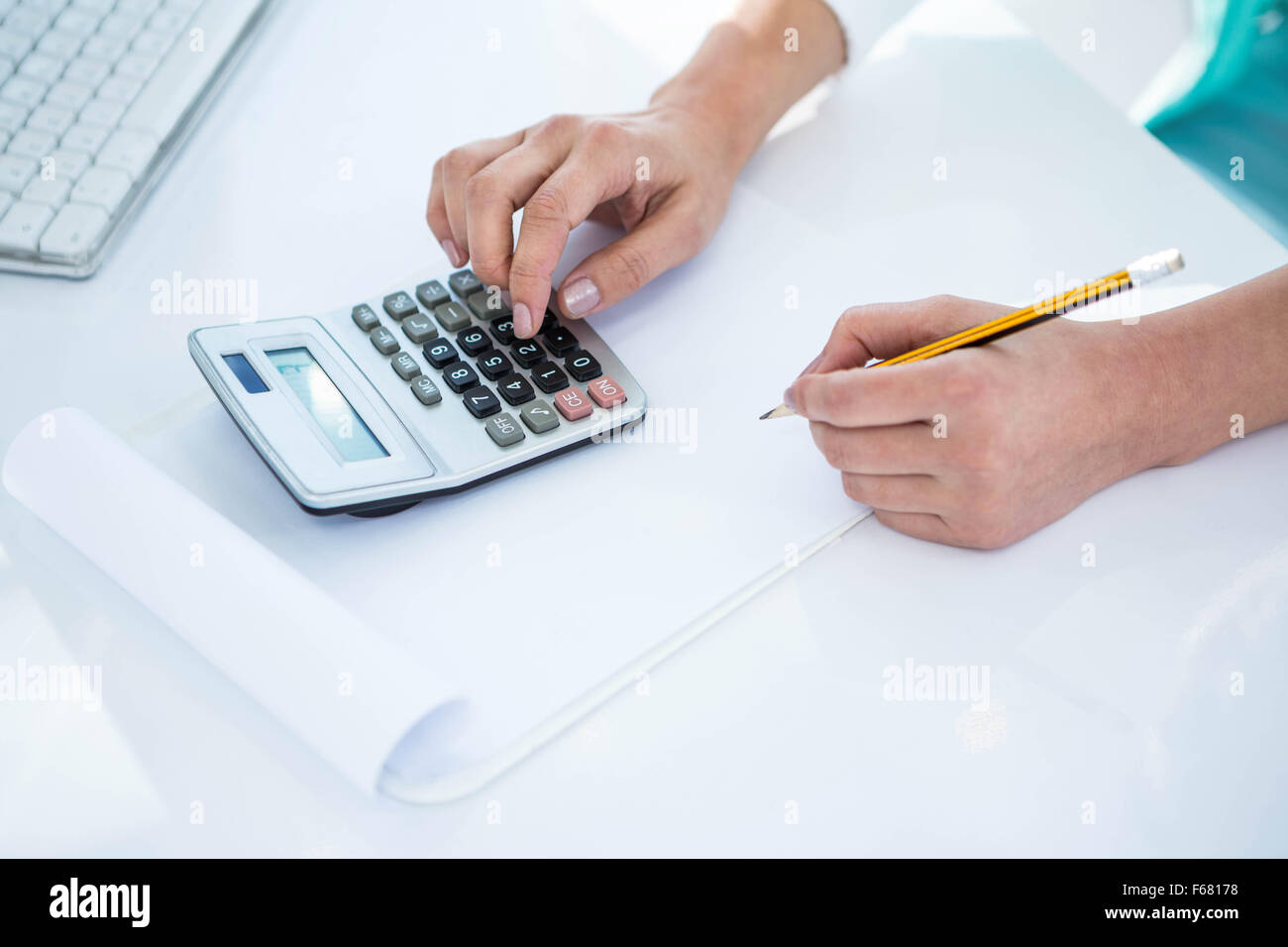 Smiling woman taking down notes Stock Photo - Alamy
