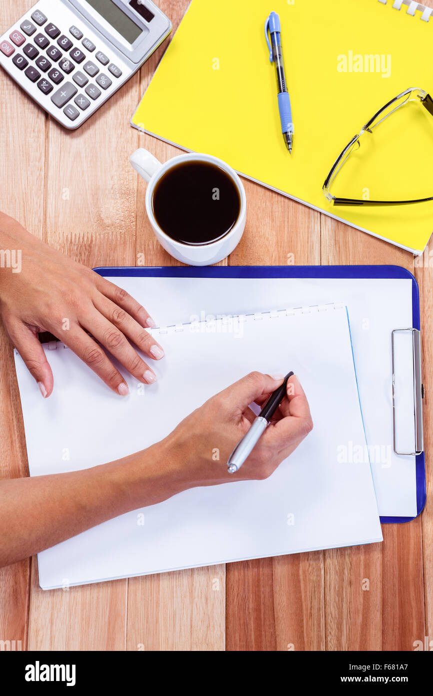 Part of hands taking notes Stock Photo - Alamy