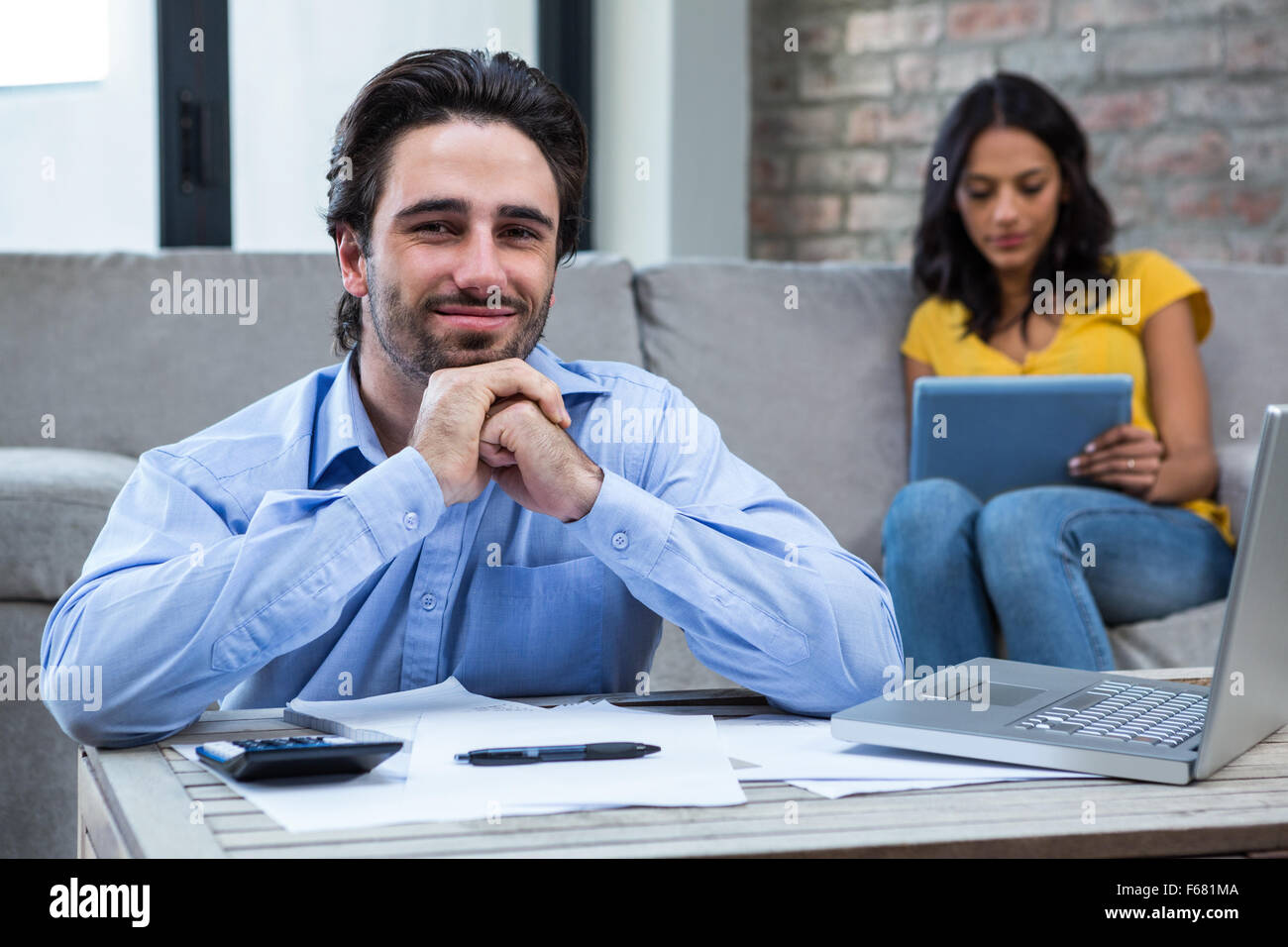 Man using calculator and smiling hi-res stock photography and images ...