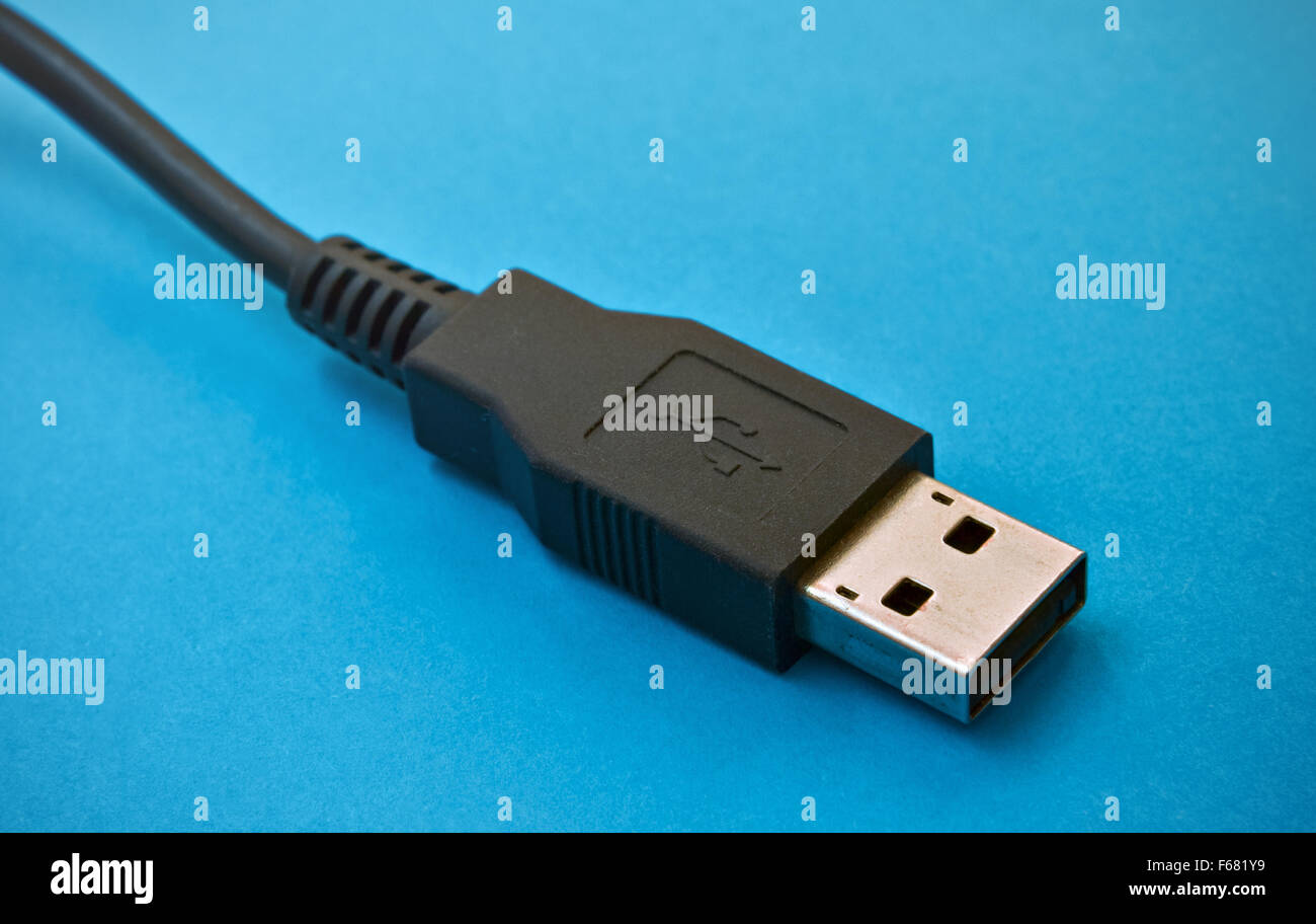 Closeup of a black usb cable on saturated blue background Stock Photo ...