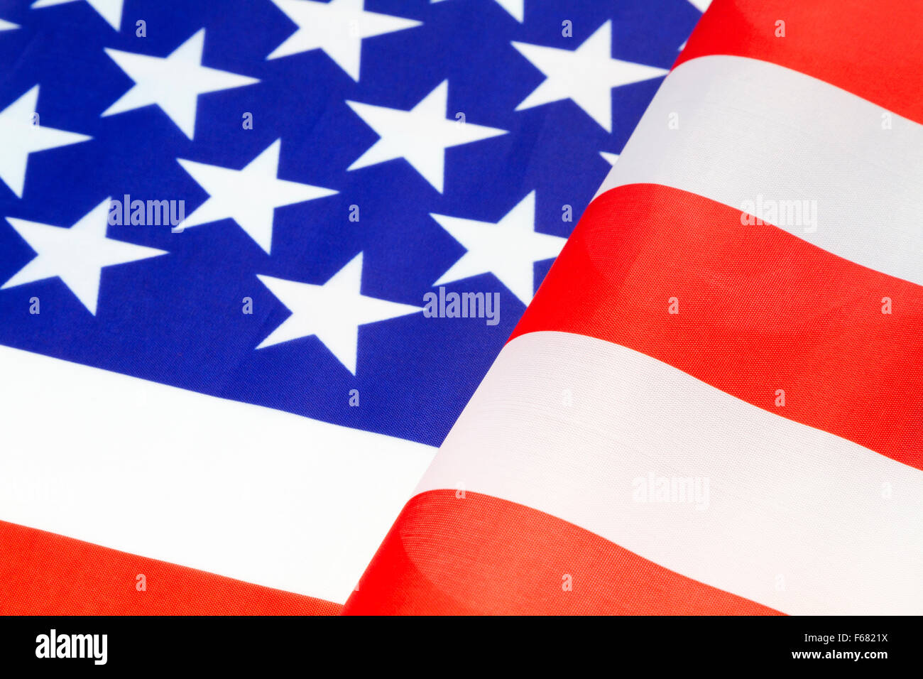 Rippling furls of the American flag are rich red, white, and blue ...