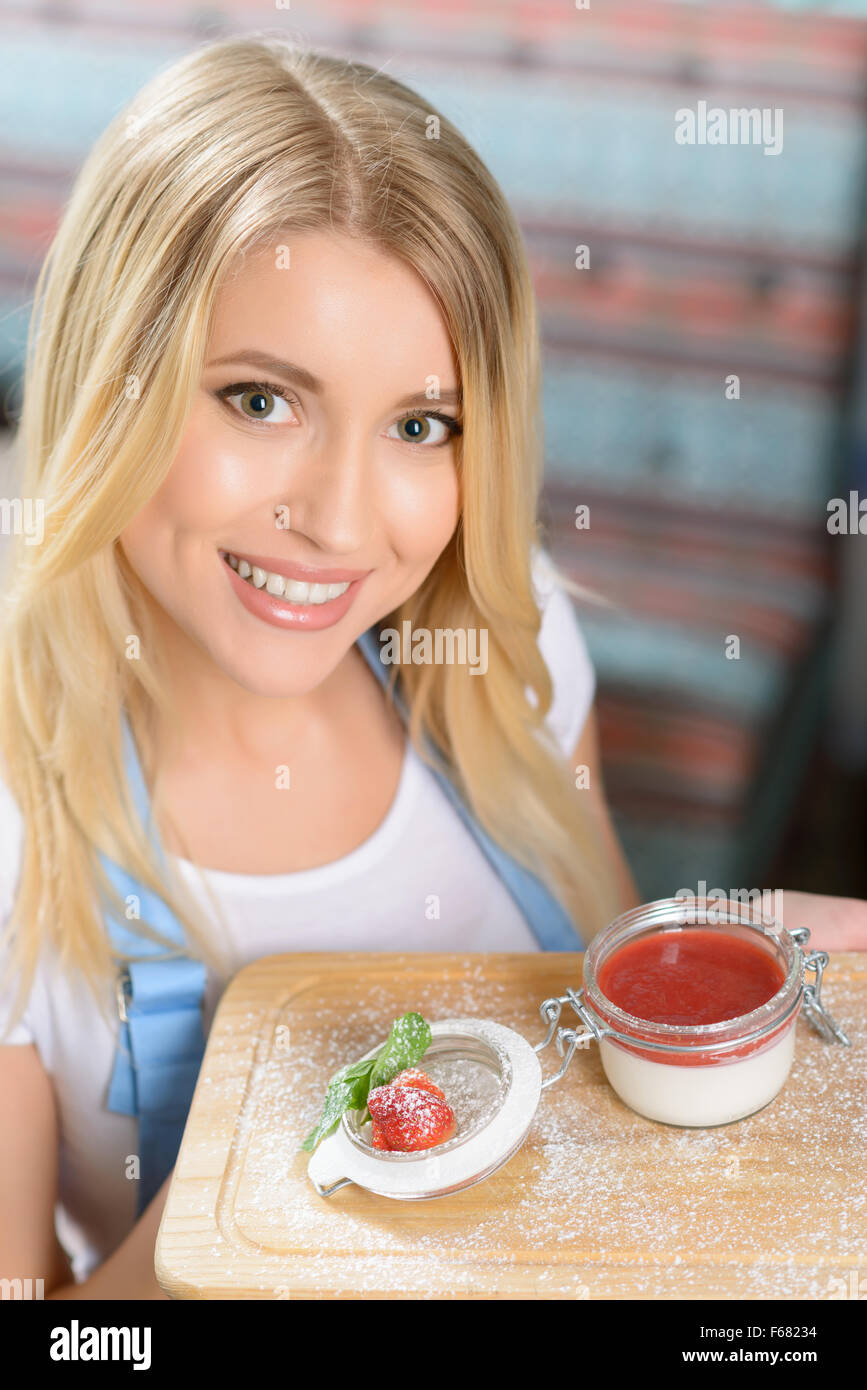 Pleasant waitress waiting at table Stock Photo - Alamy
